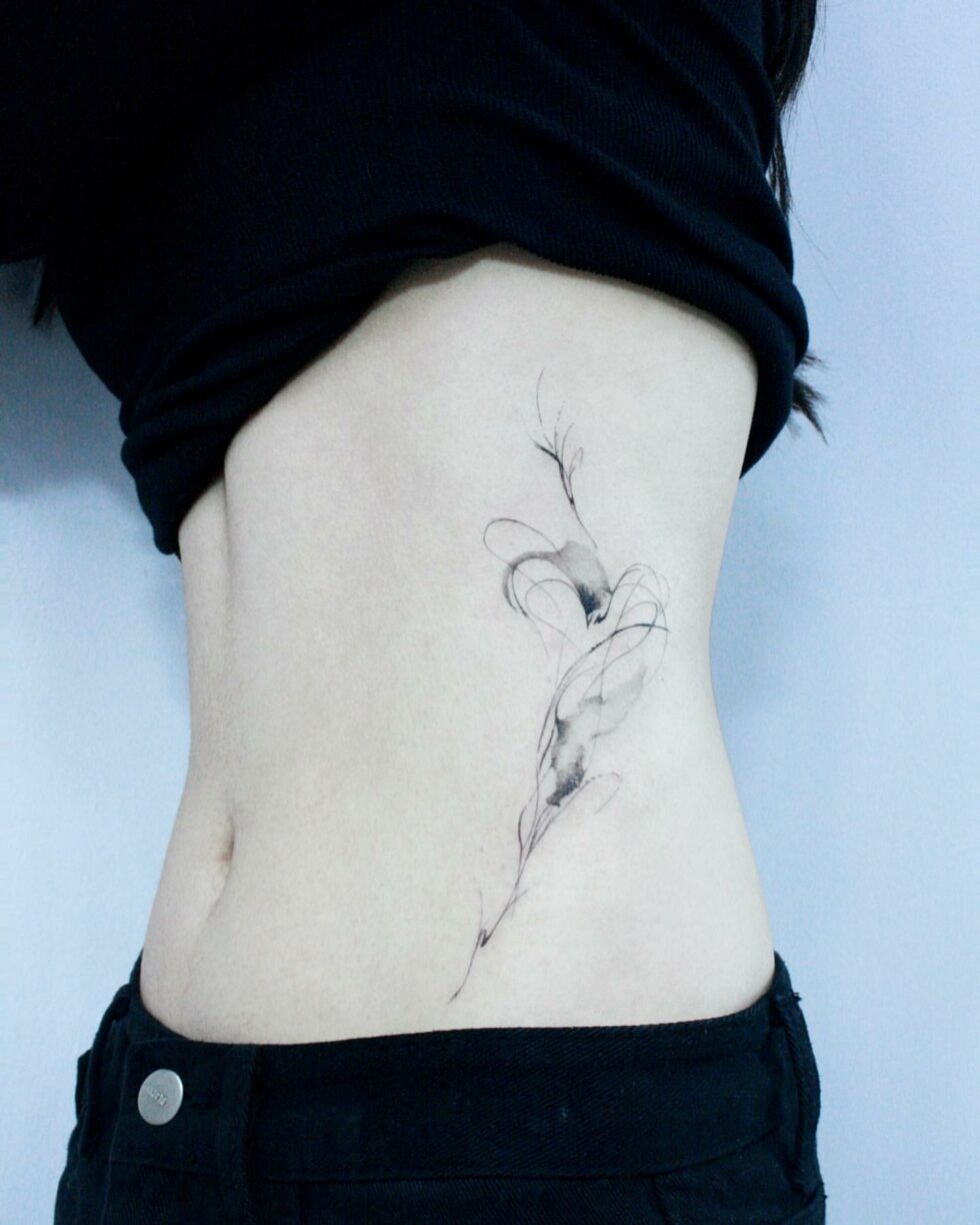 36 Awesome Rib Tattoo Ideas for Men & Women in 2024