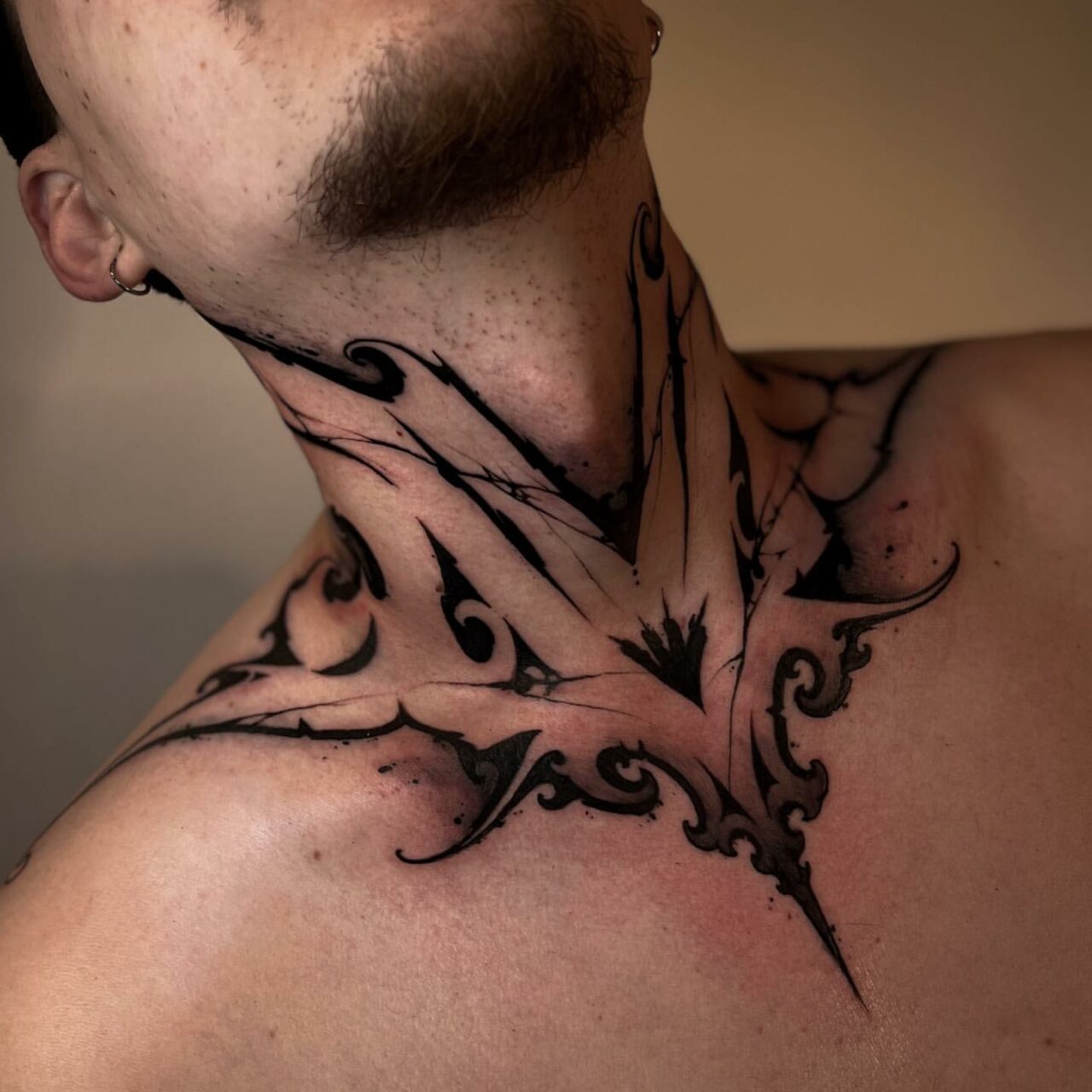 32 Eye-catching Throat Tattoos for Men in 2024